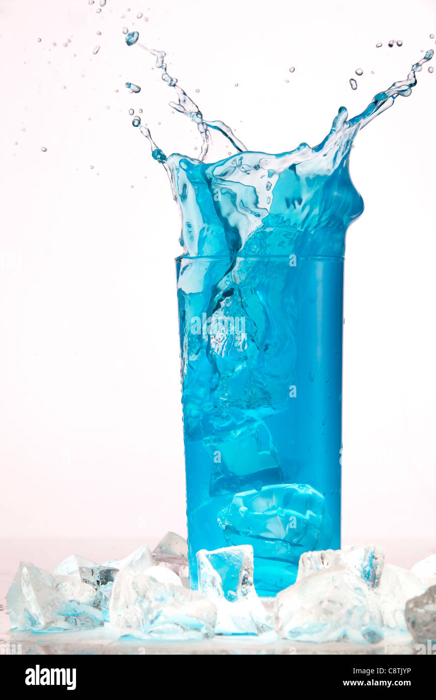 Blue Drink Splashing In A Glass Stock Photo - Alamy