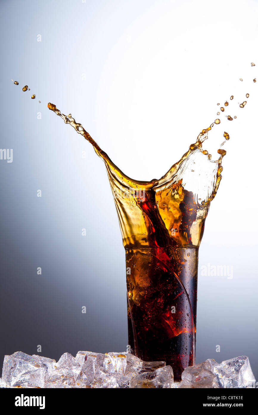 Drink Splashing In A Glass Stock Photo - Alamy