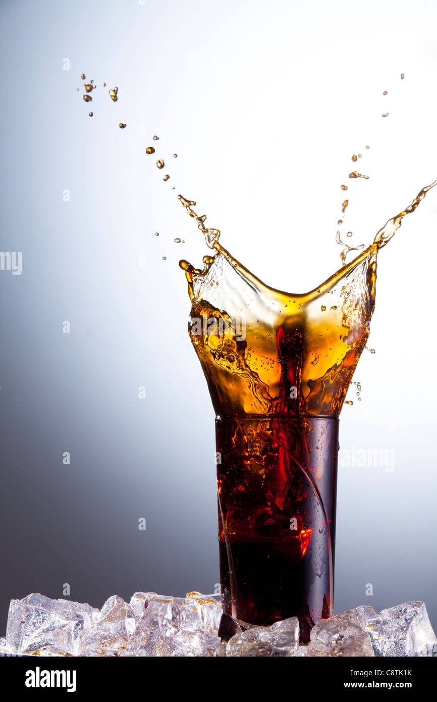 Drink Splashing In A Glass Stock Photo - Alamy
