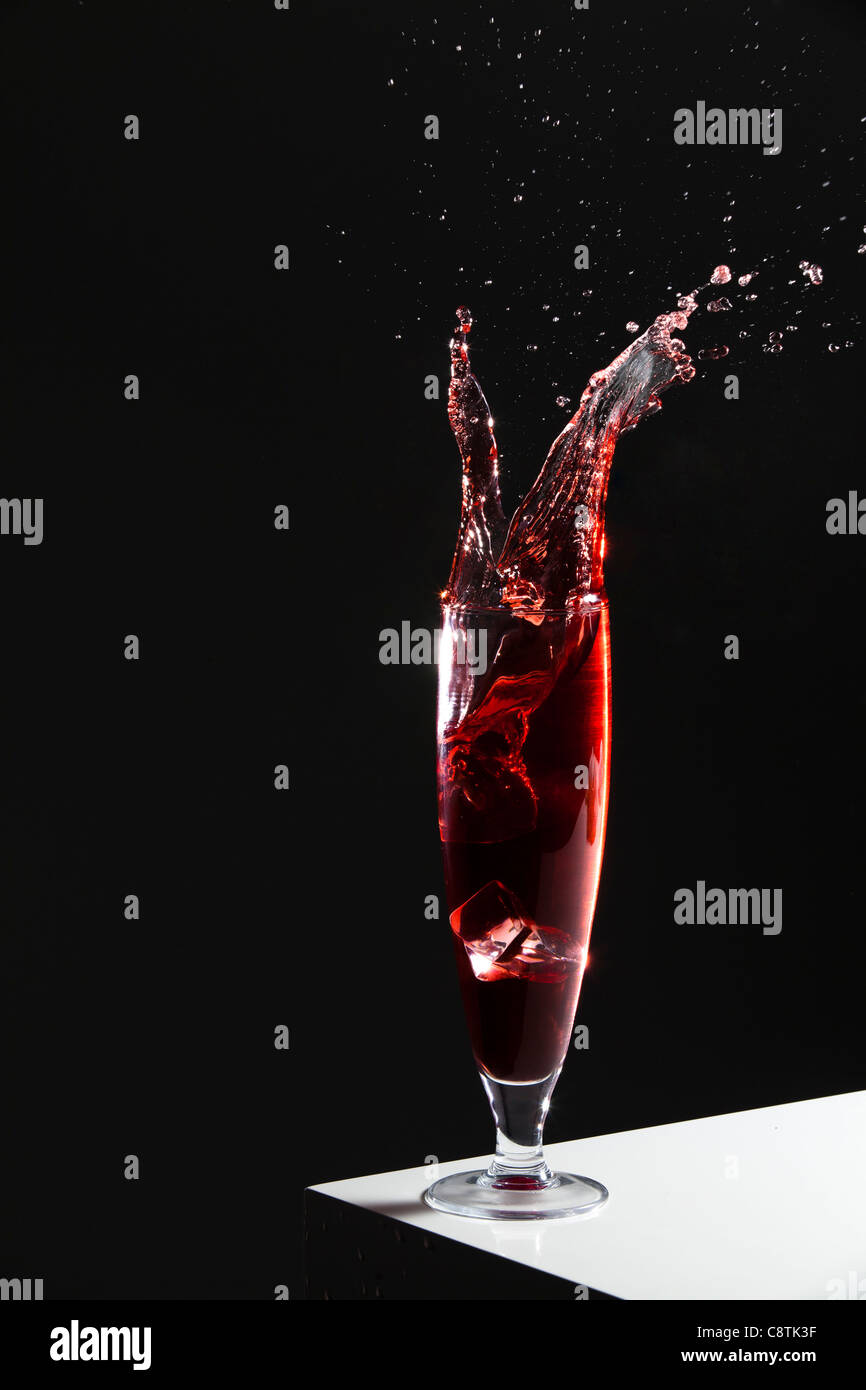 Drink Splashing In A Glass Stock Photo - Alamy