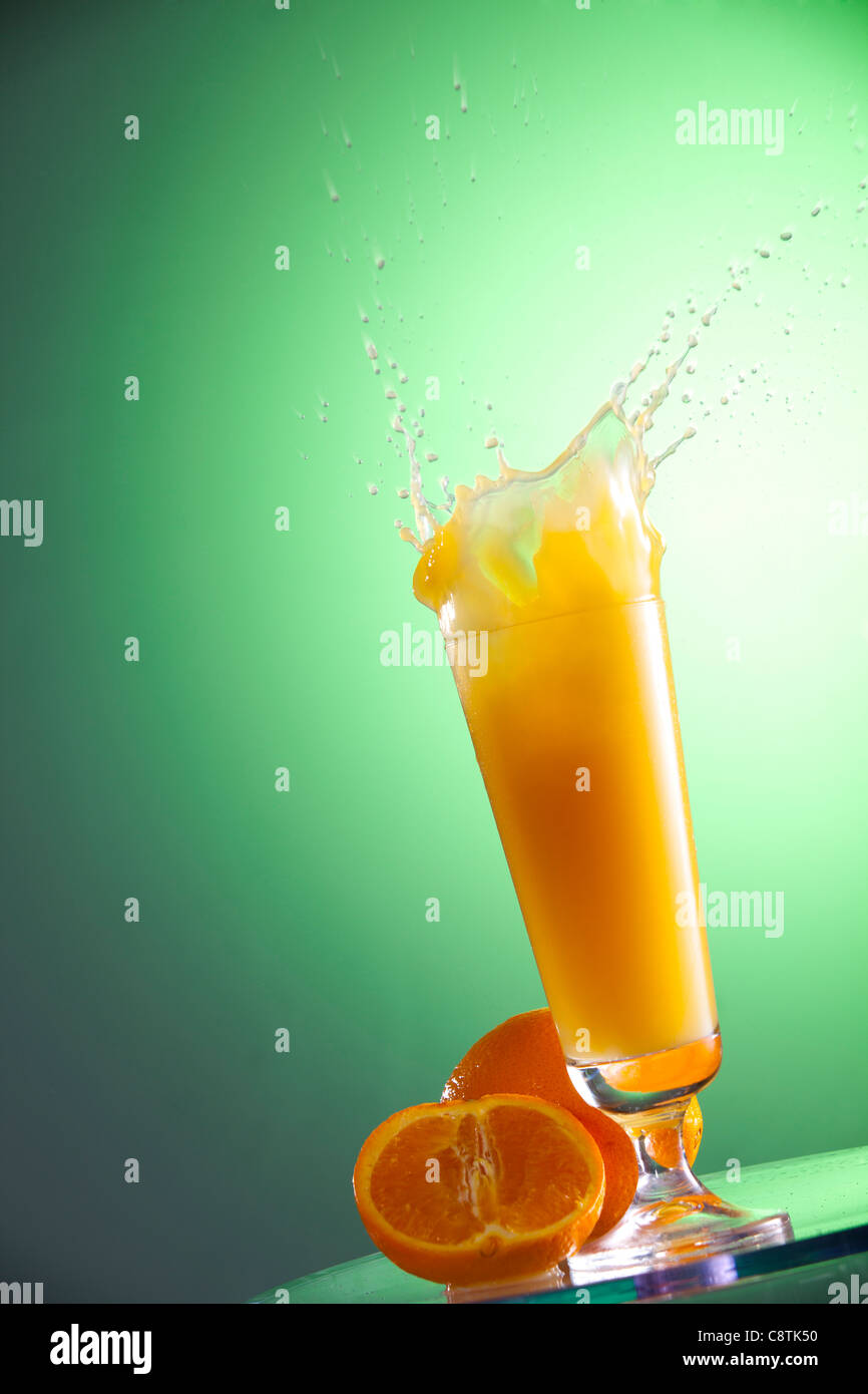 Juice Splashing In A Glass Stock Photo - Alamy