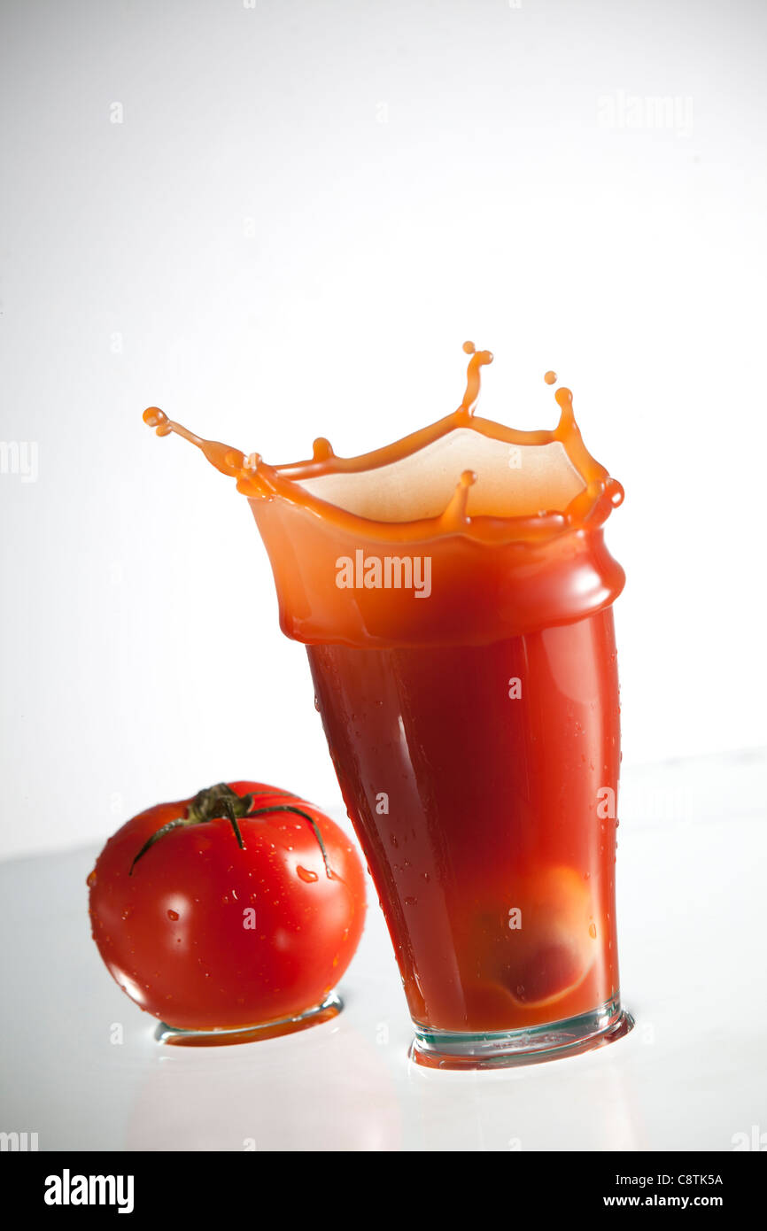 Juice Splashing In A Glass Stock Photo - Alamy