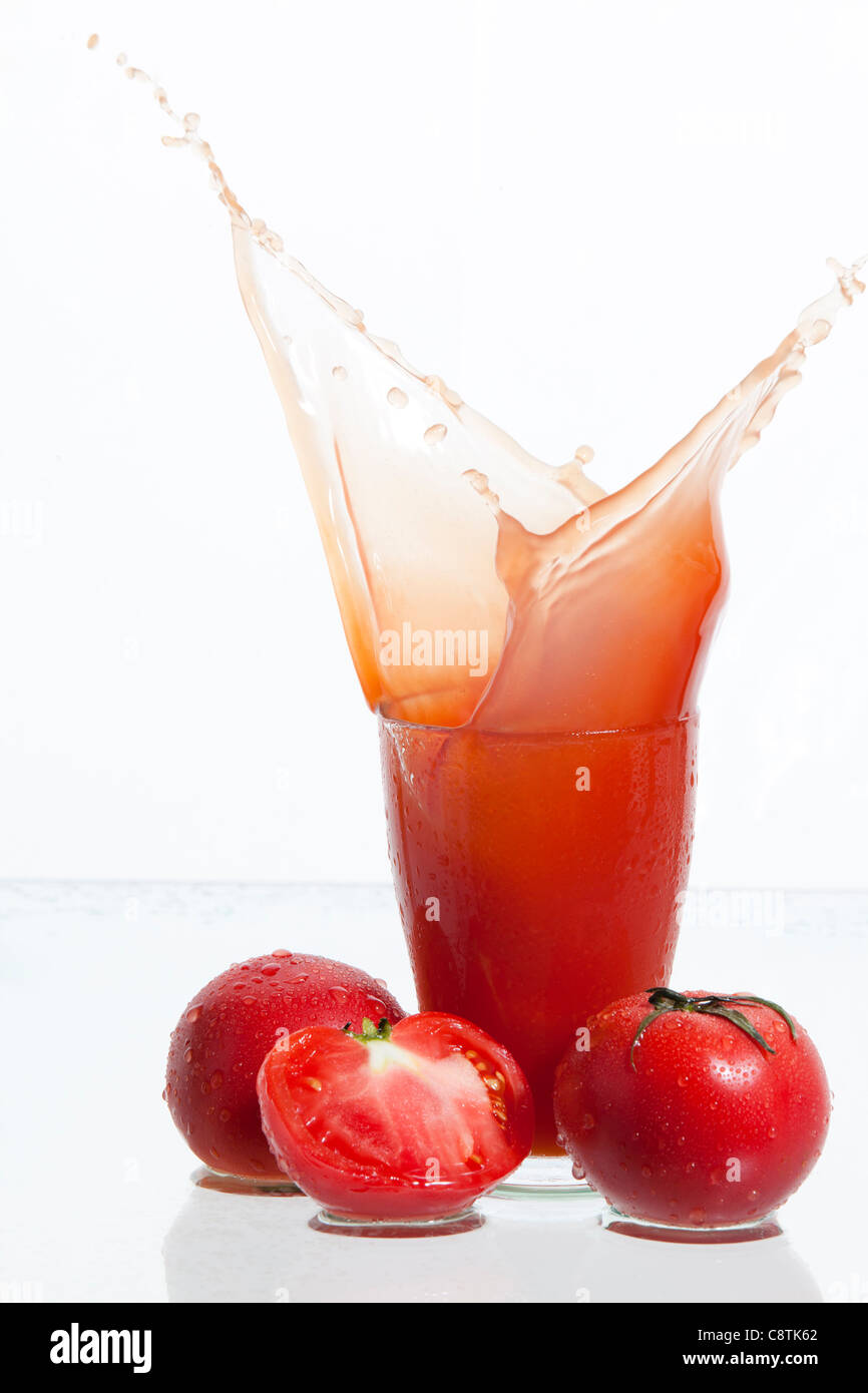 Juice Splashing In A Glass Stock Photo - Alamy