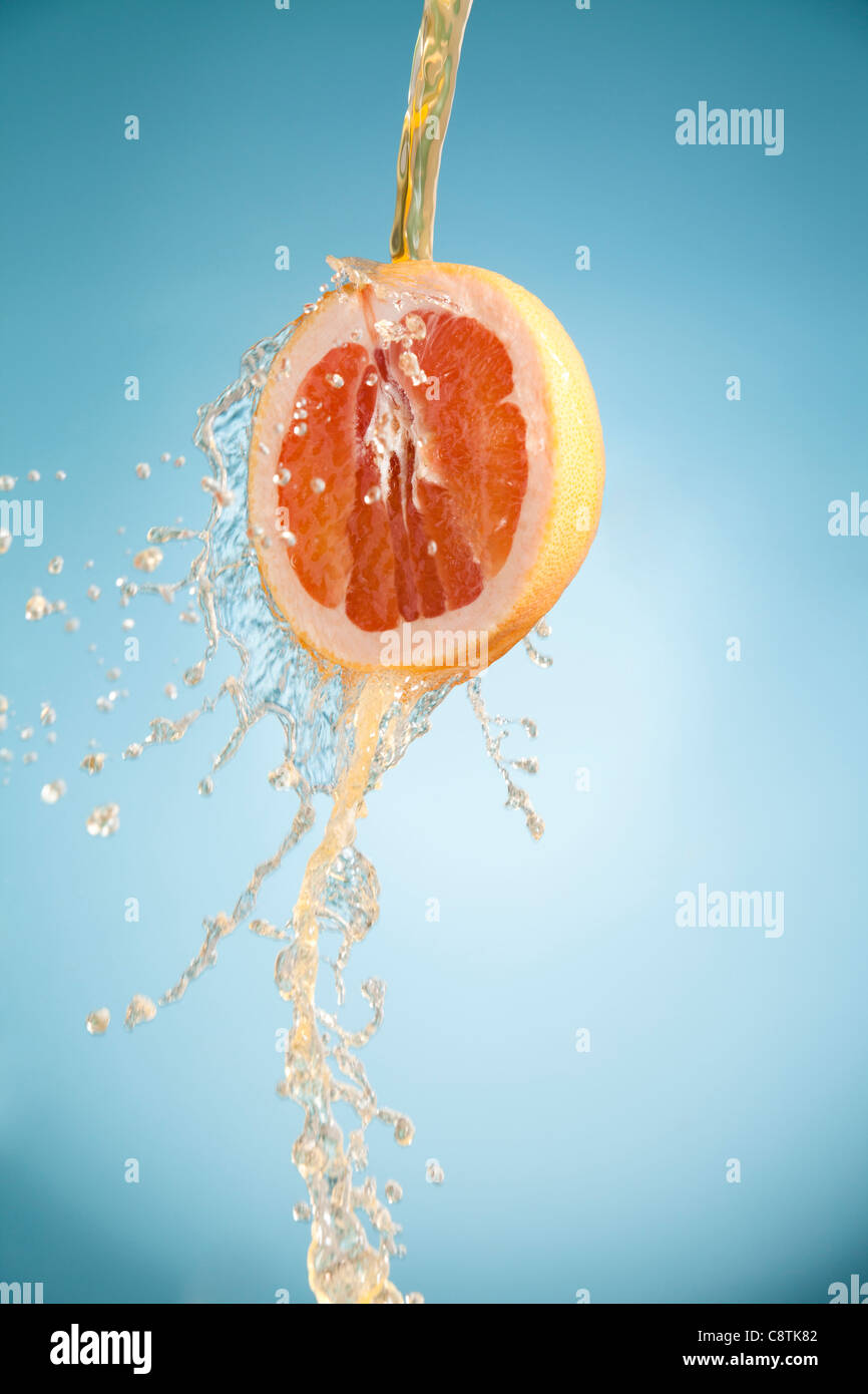 Juice Pouring On A Fruit Stock Photo - Alamy