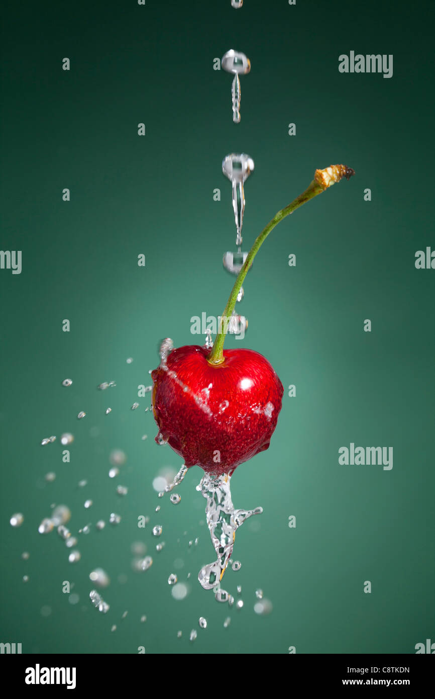 Cherry Splashing In Water Stock Photo - Alamy