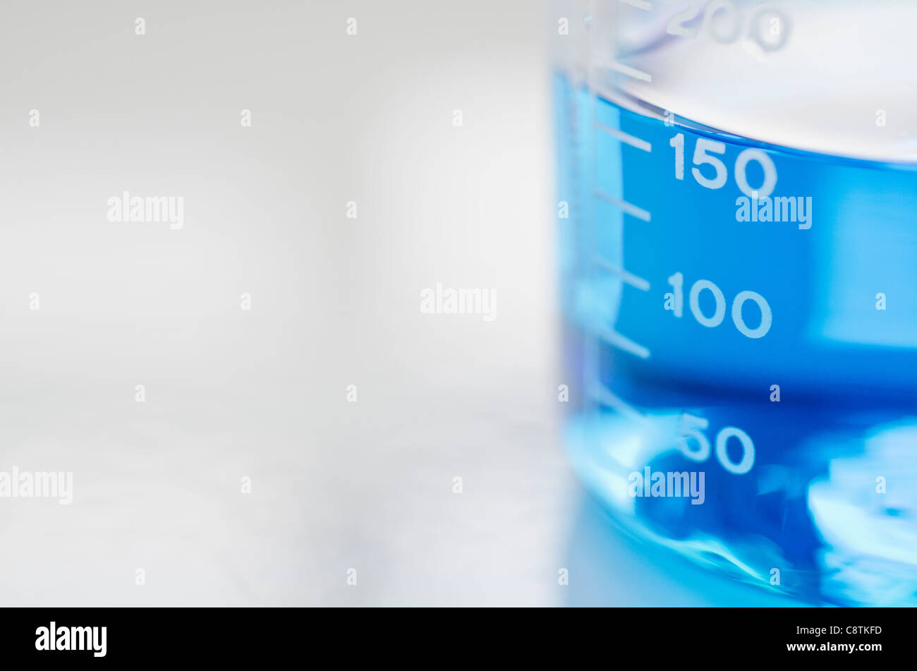 Studio shot of laboratory beaker with blue liquid Stock Photo - Alamy