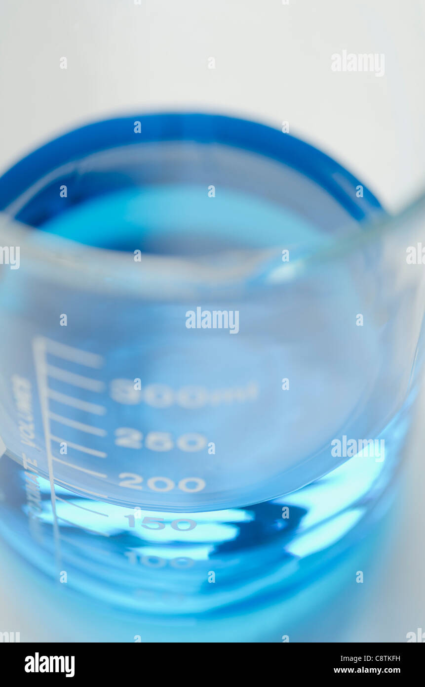 Studio shot of laboratory beaker with blue liquid Stock Photo - Alamy