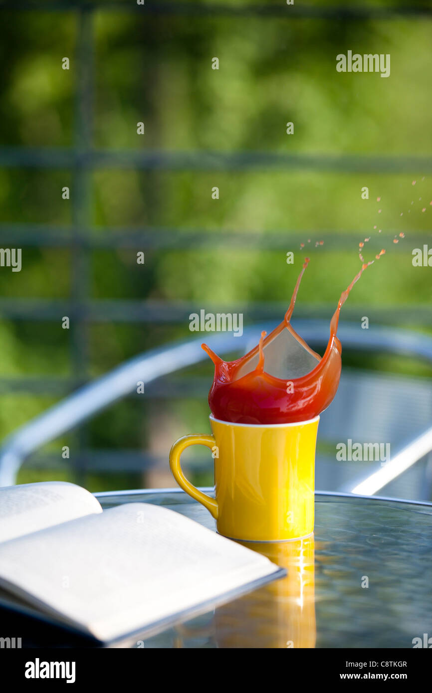 Drink Splashing In A Cup Stock Photo - Alamy