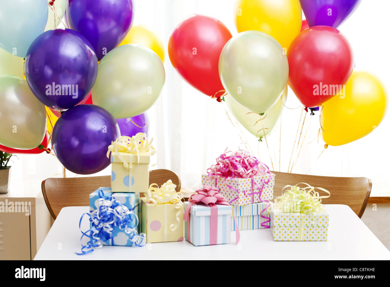 Gift With Balloons Stock Photo - Alamy