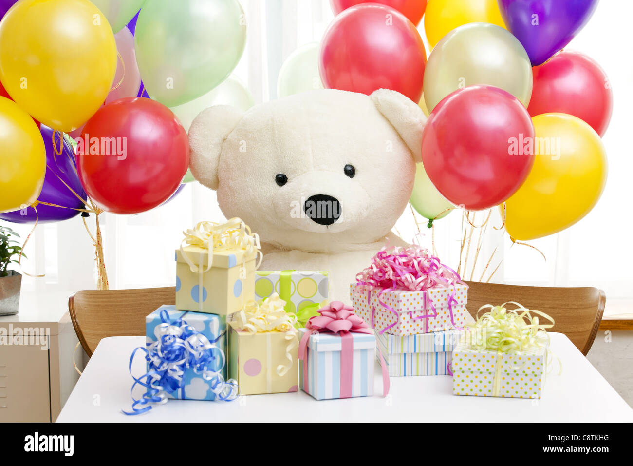 Teddy Bear With Gift And Balloon Stock Photo - Alamy