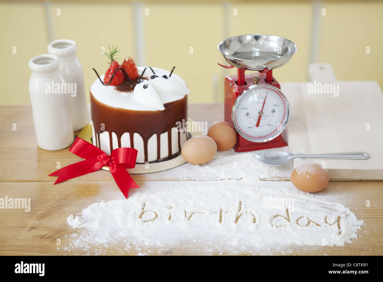 Birthday Cake With Egg And Weighing Machine Stock Photo - Alamy