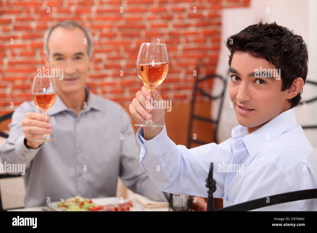 Men eating lunch in a restaurant Stock Photo - Alamy