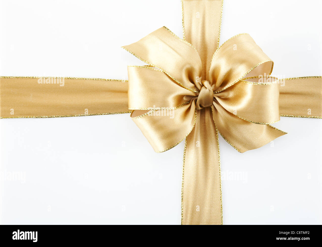 Golden Ribbon With Bow Stock Photo - Alamy
