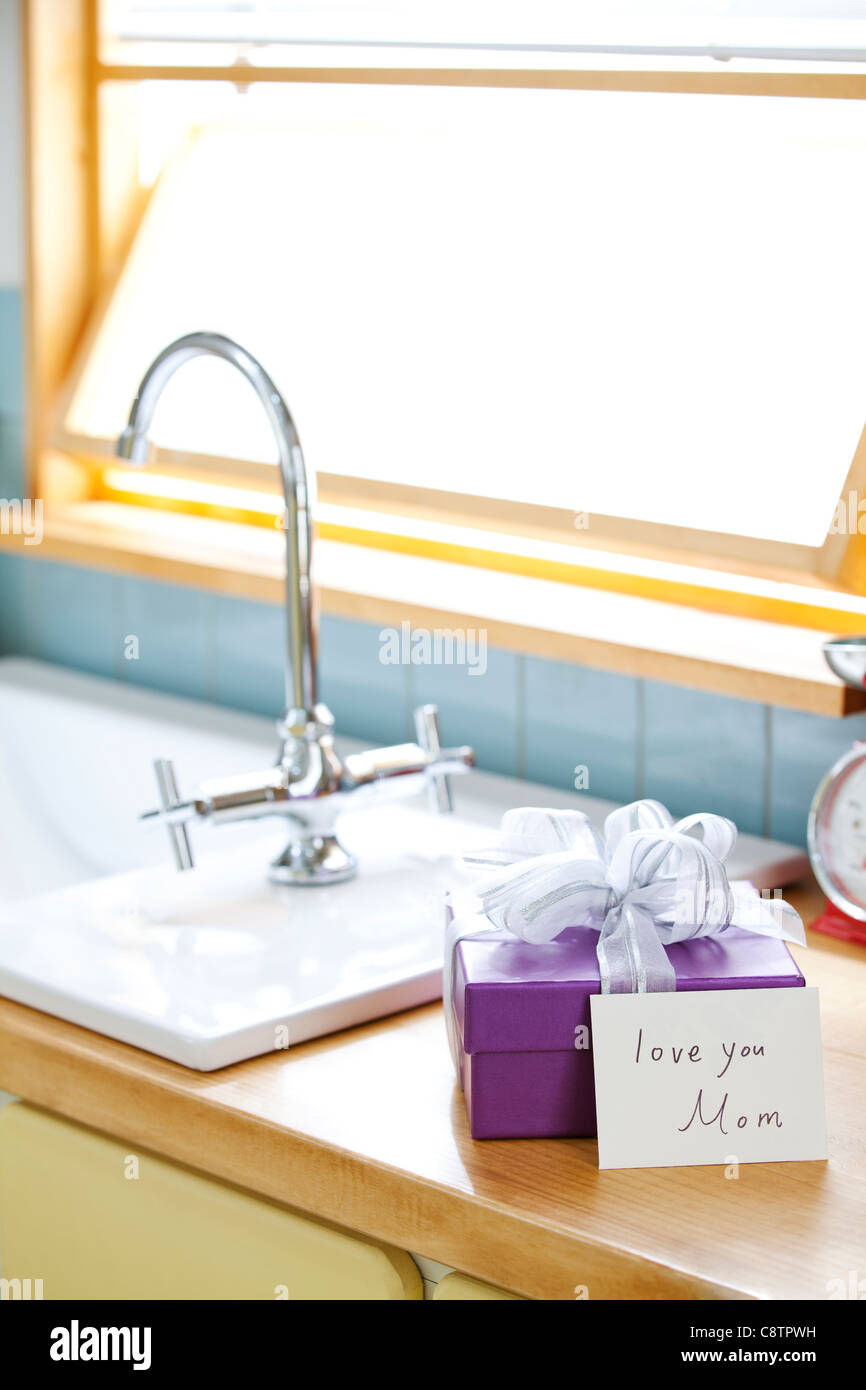Wrapped Gift Box On The Kitchen Sink Stock Photo - Alamy