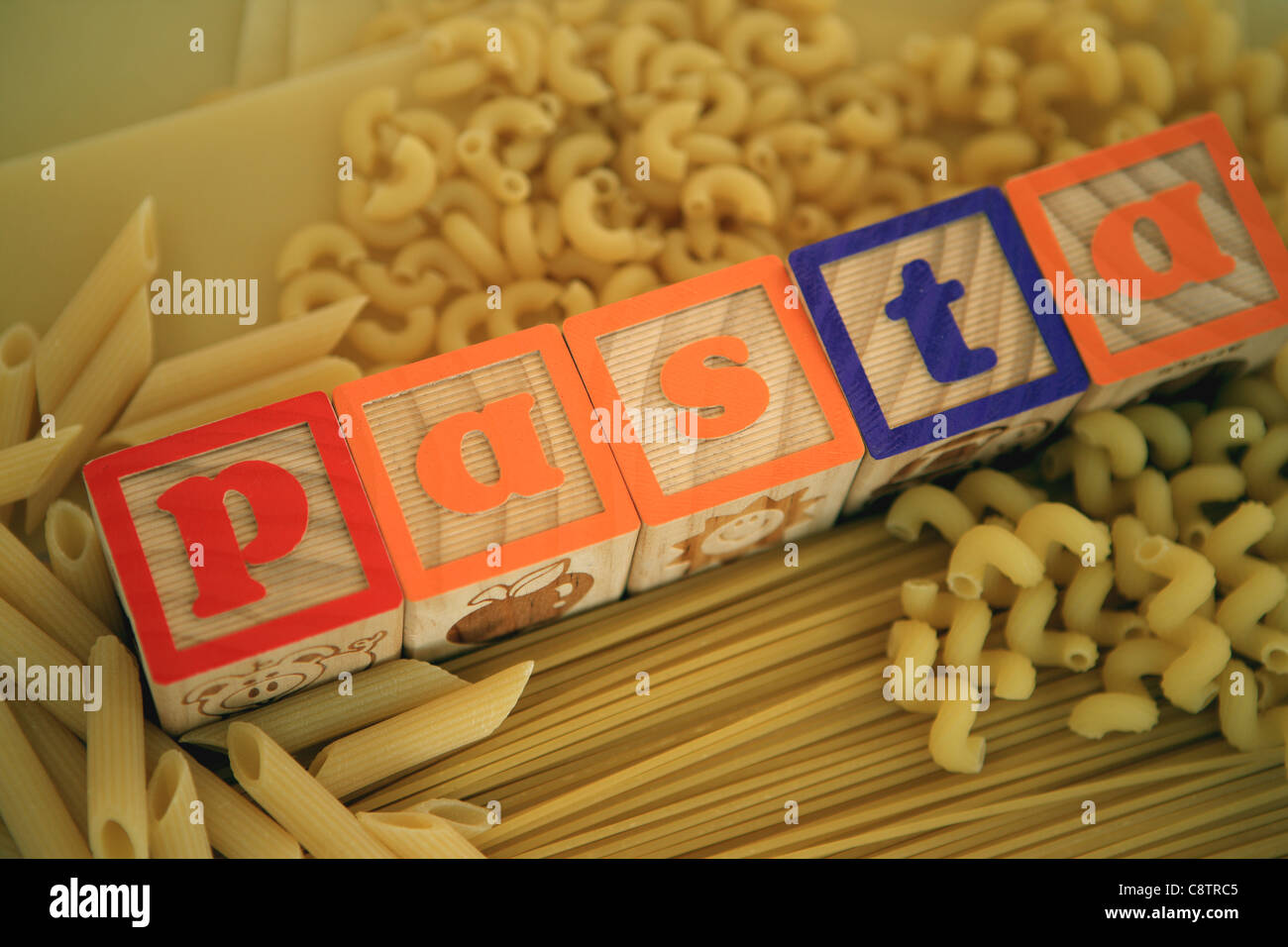 Pasta spelled out with building blocks on top of differing types of ...