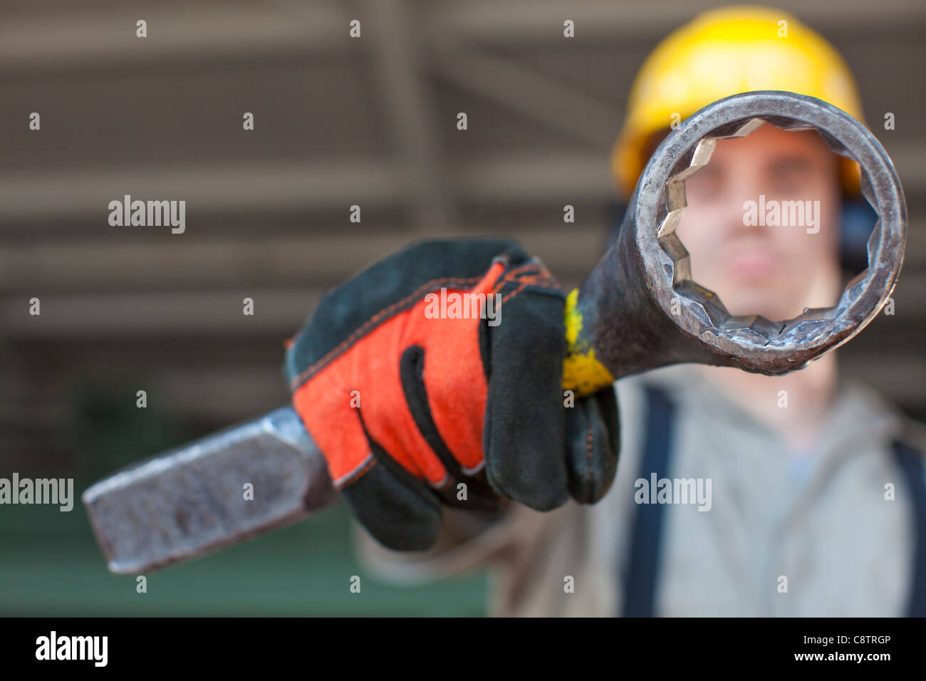 Happy worker showing tool hi-res stock photography and images - Alamy