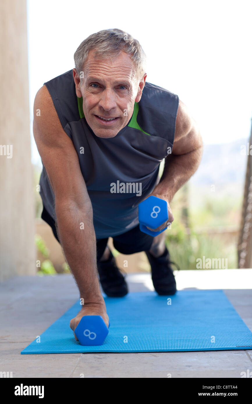 USA, Arizona, Scottsdale, Portrait of senior man doing push-ups Stock ...