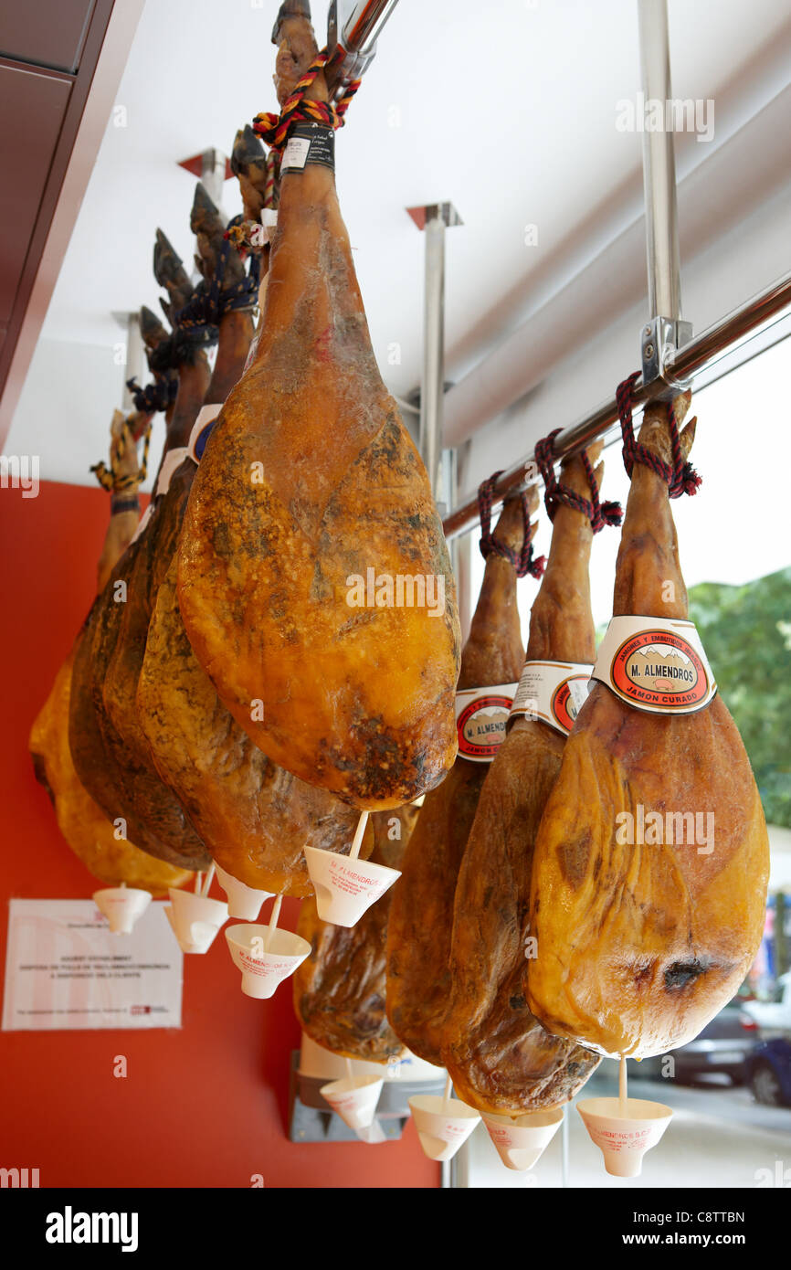 A selection of Jamon, Spanish dry-cured ham displayed for sale in a ...