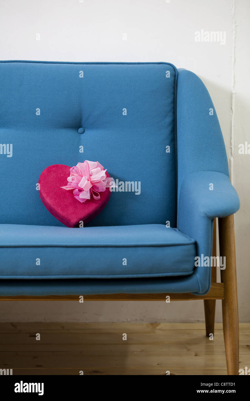 Heart Shape Gift On Couch Stock Photo - Alamy