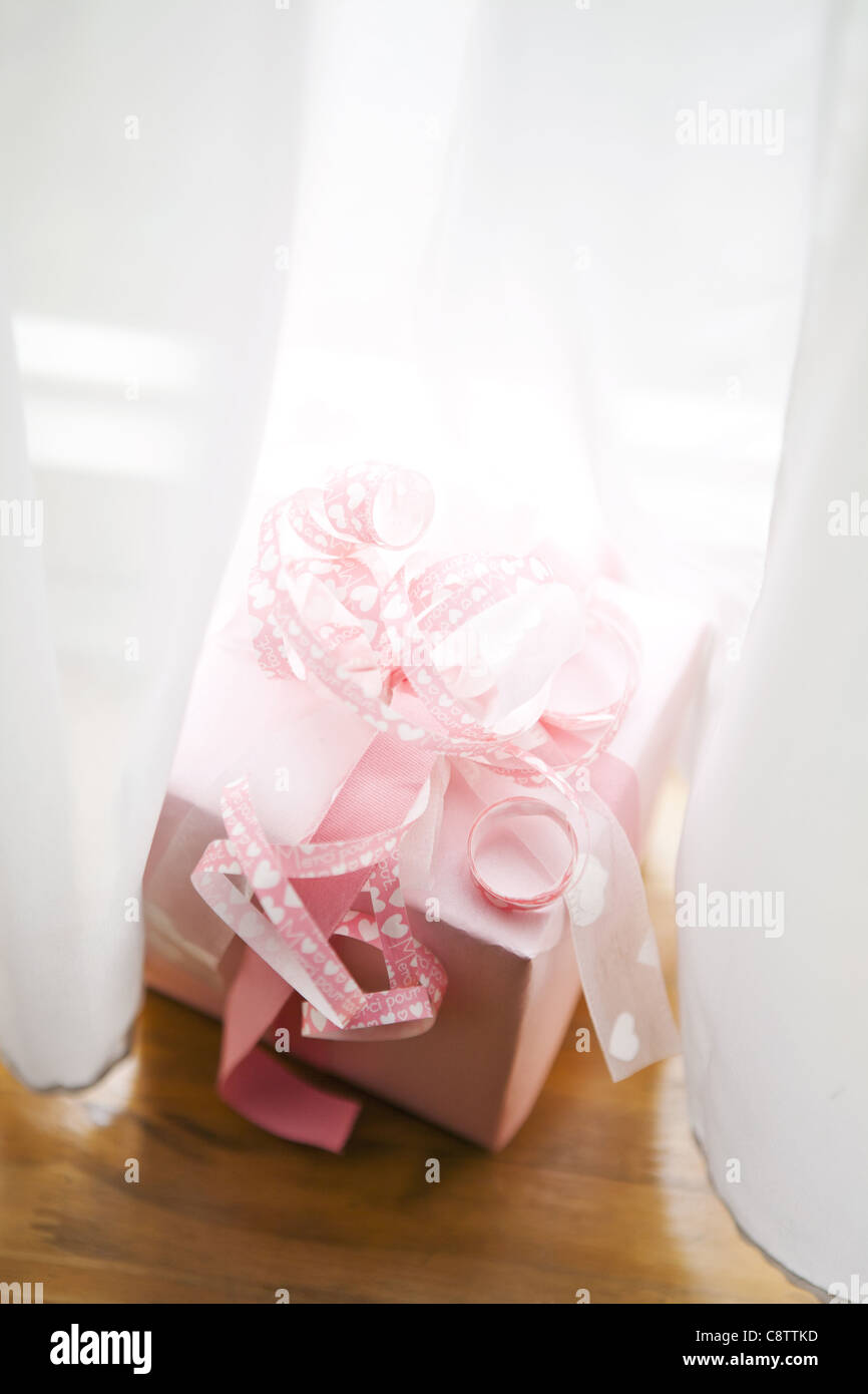 Wrapped Pink Gift Box On Table Stock Photo - Alamy