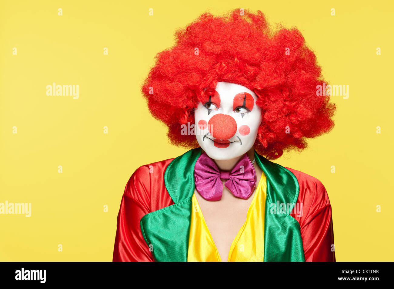 a female clown with colorful clothes and makeup Stock Photo - Alamy