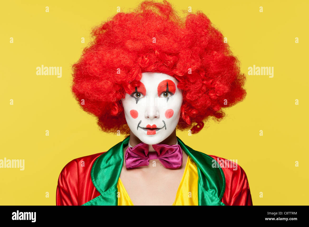 a female clown with colorful clothes and makeup Stock Photo - Alamy