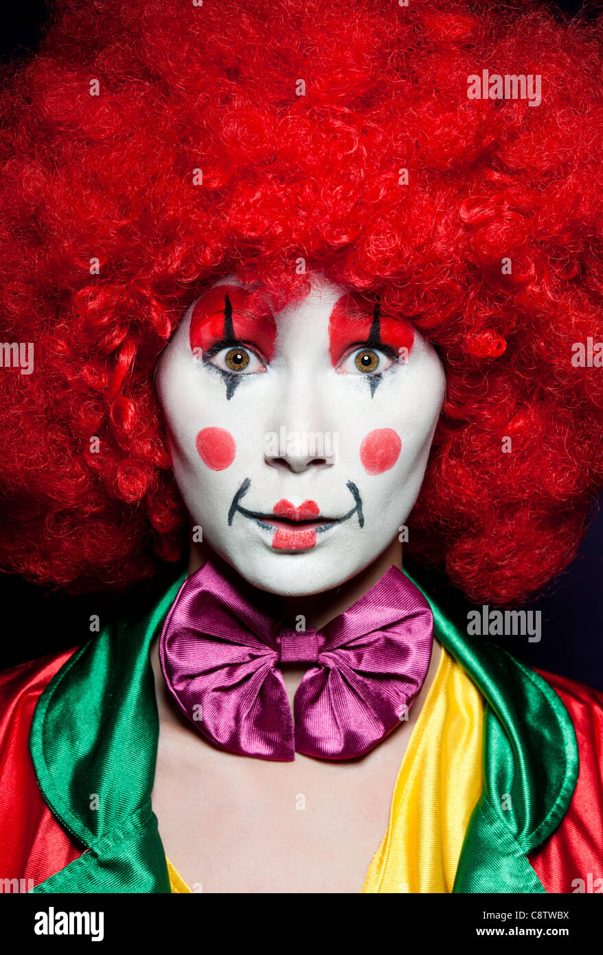a female clown with colorful clothes and makeup Stock Photo - Alamy