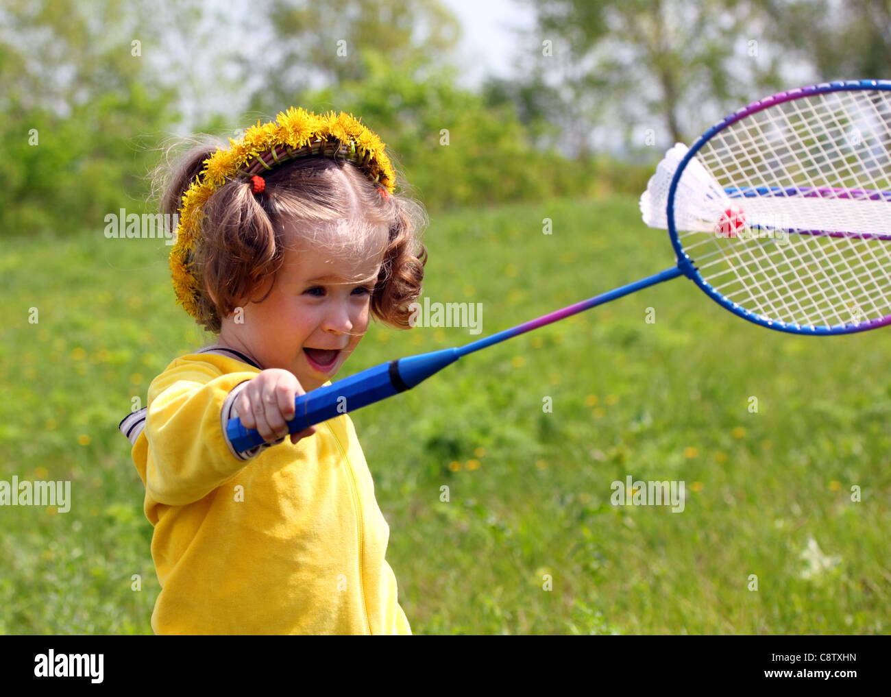 little girl playing badminton on spring meadow Stock Photo - Alamy