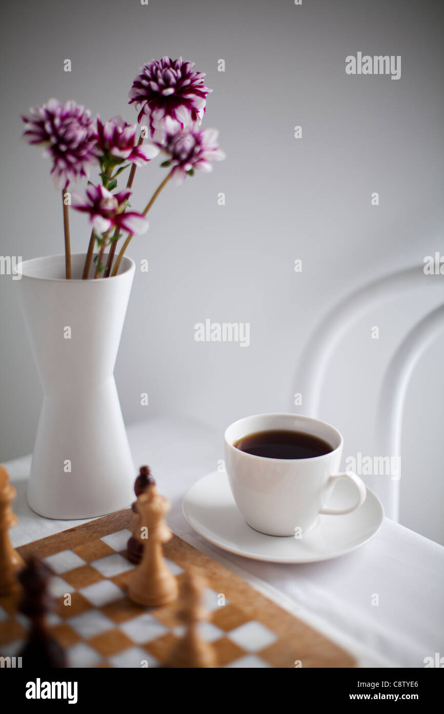 Flowers With Chess And Coffee Stock Photo - Alamy