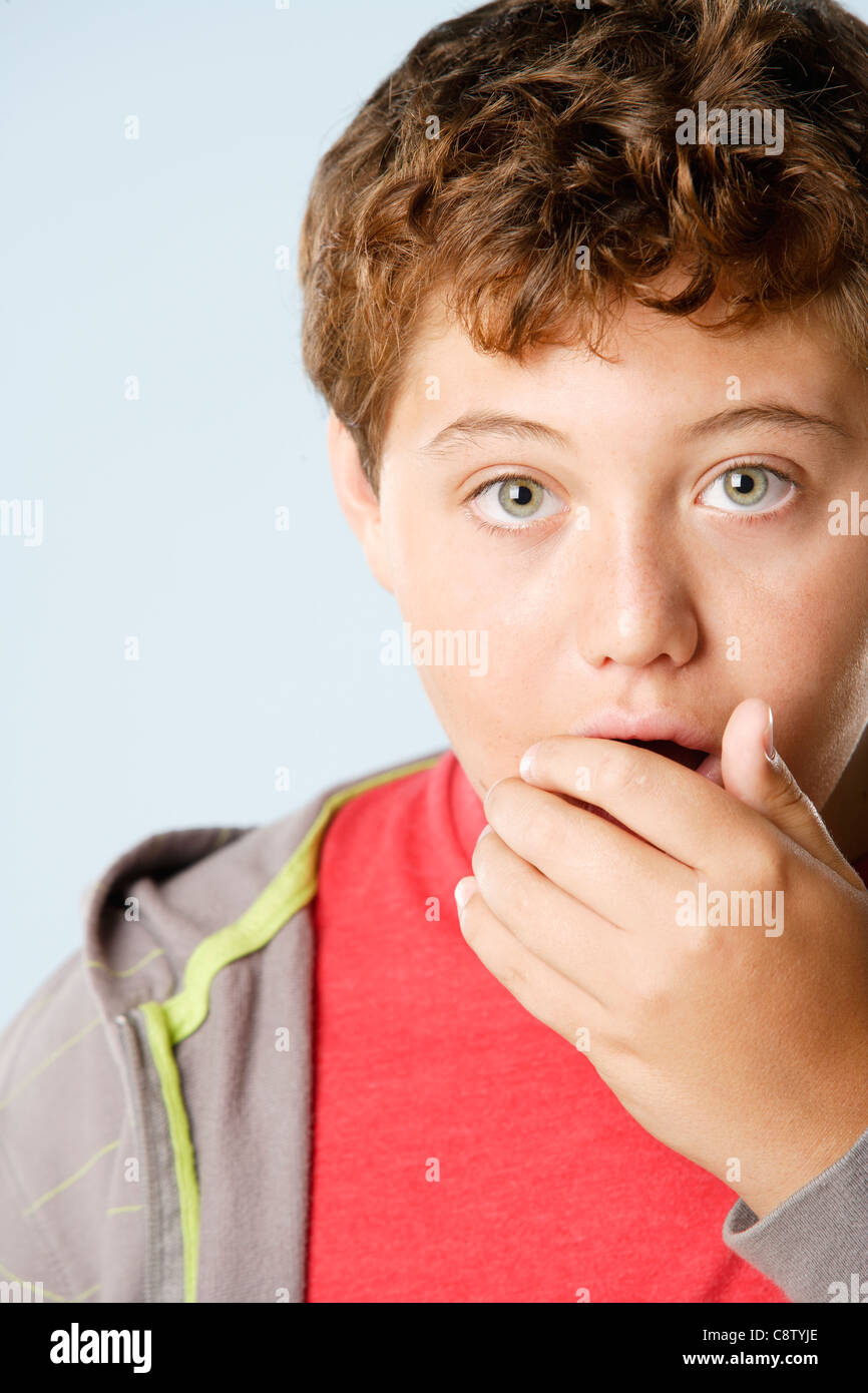 Child hand over mouth hi-res stock photography and images - Alamy