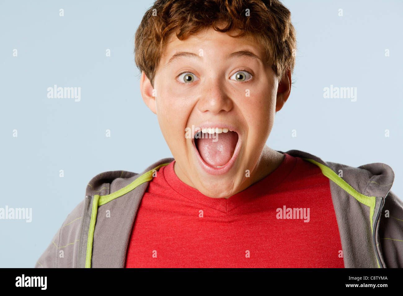 Studio portrait of boy looking surprised Stock Photo - Alamy