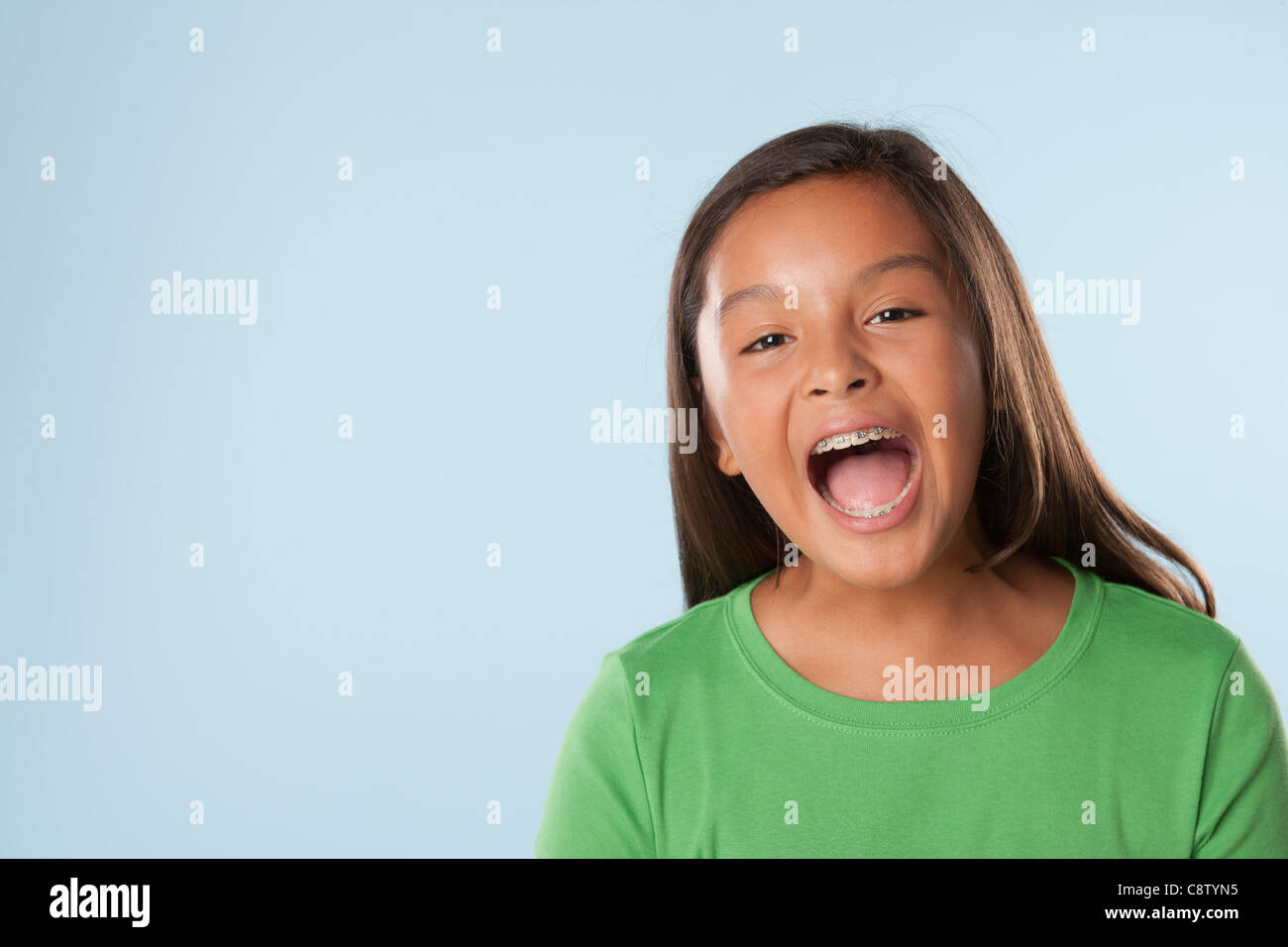 Studio portrait of girl shouting Stock Photo - Alamy