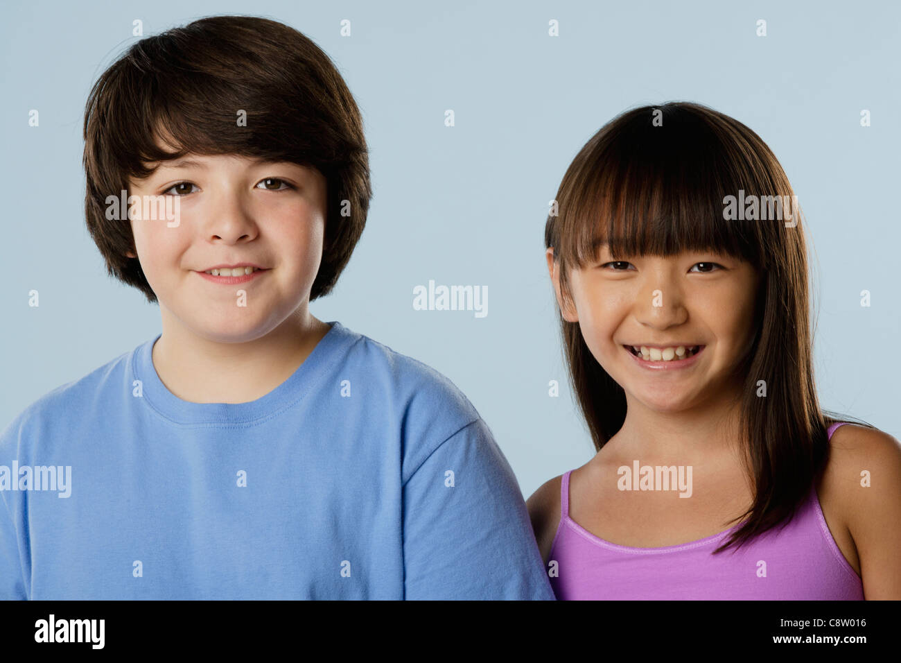 Studio portrait of boy and girl Stock Photo - Alamy