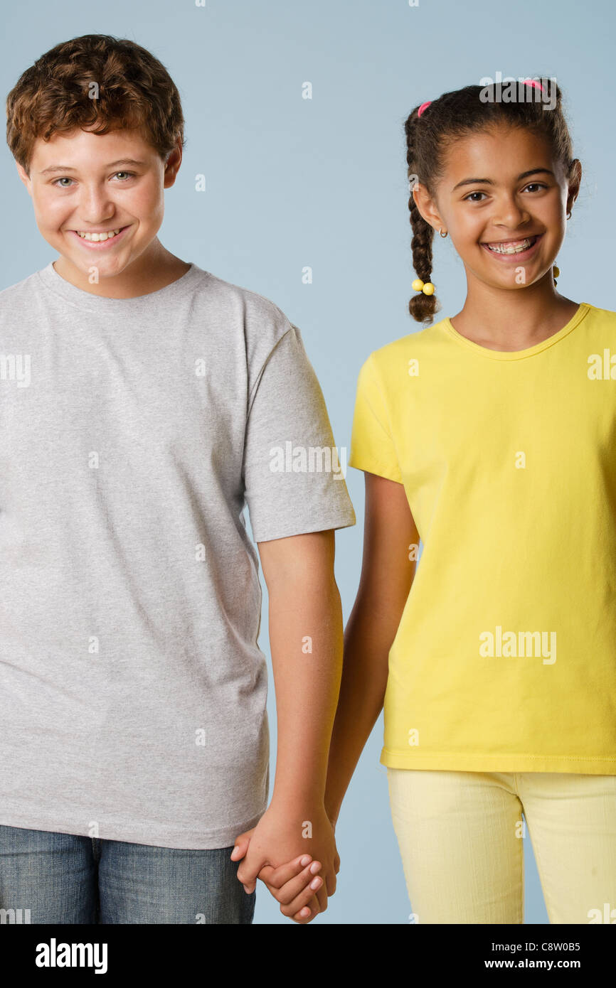 Studio portrait of boy and girl Stock Photo - Alamy