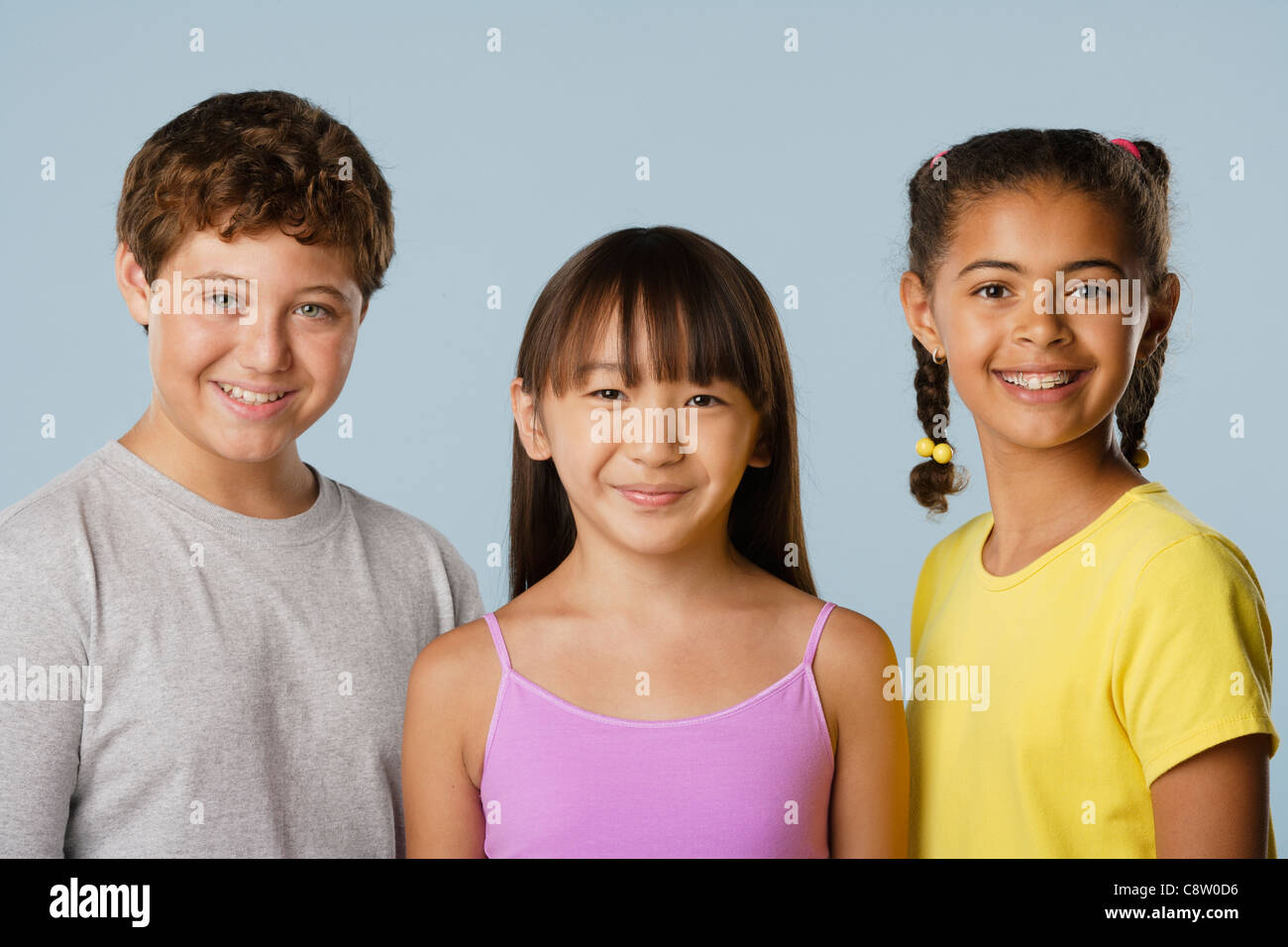 Studio portrait of boy and girls Stock Photo - Alamy