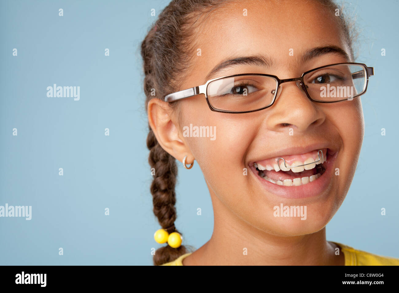 Studio portrait of girl laughing Stock Photo - Alamy