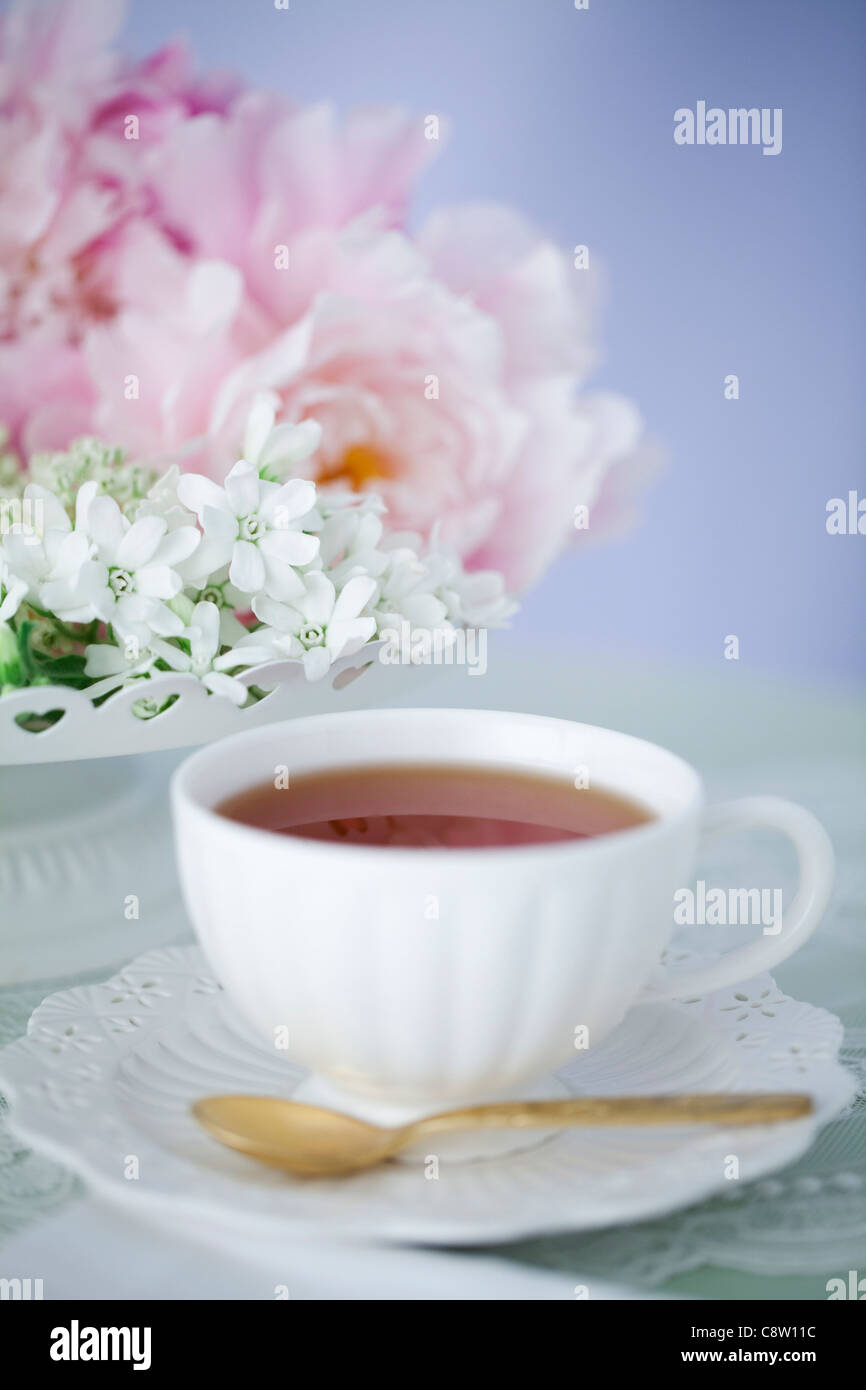 Flowers With Tea Stock Photo - Alamy