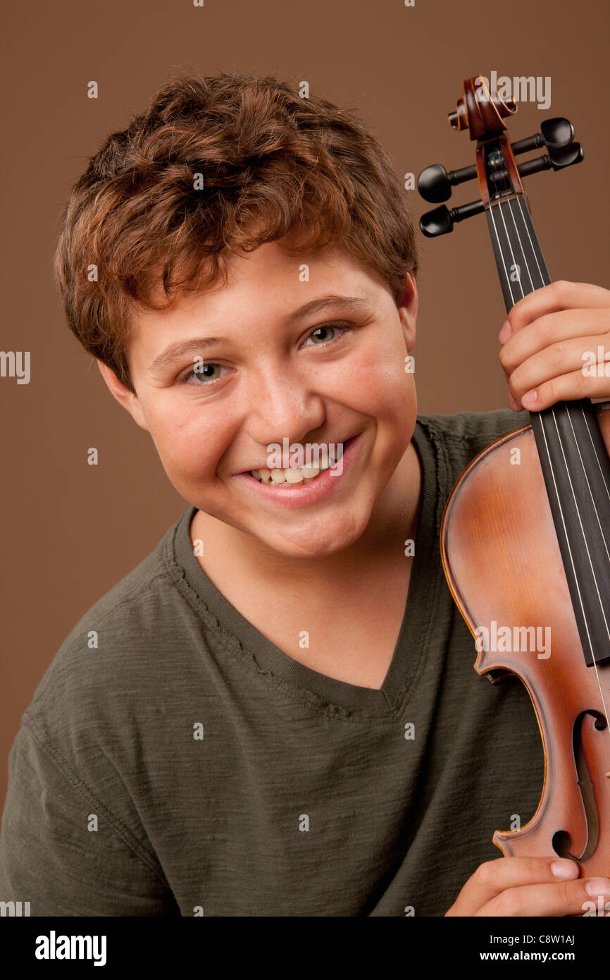 Studio portrait of boy playing violin Stock Photo - Alamy