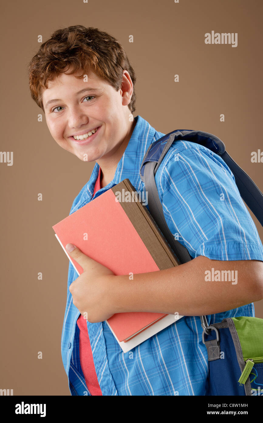 Schoolboy backpack holding books hi-res stock photography and images ...