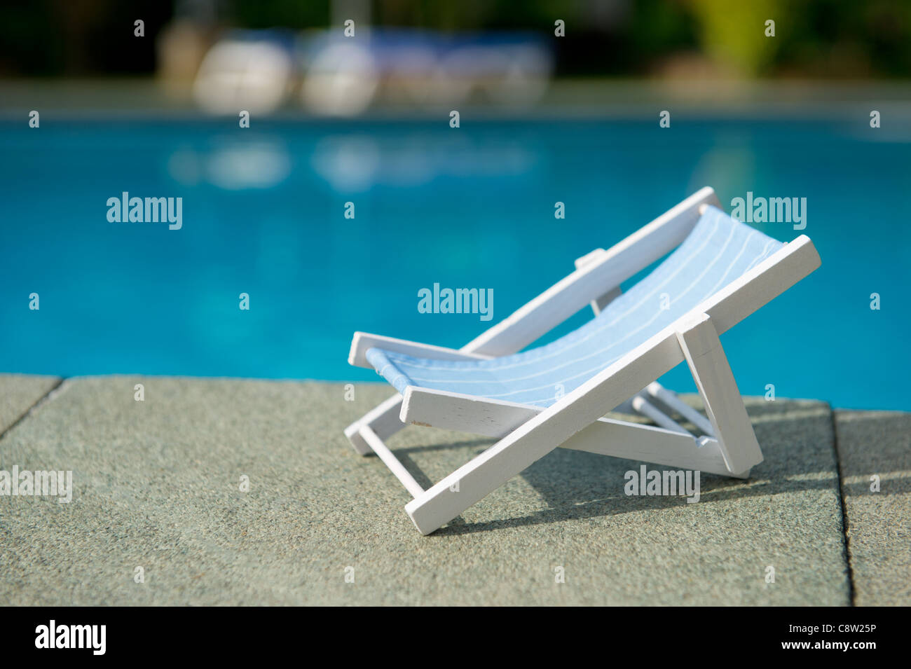 Lounge chair near the swimming pool Stock Photo - Alamy