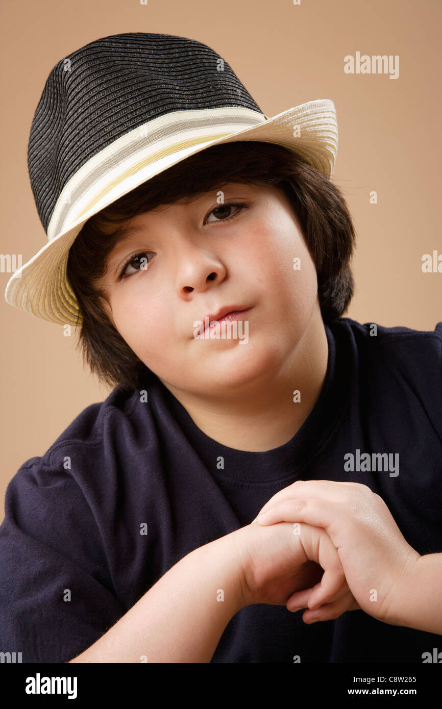 Studio portrait of boy wearing hat Stock Photo - Alamy