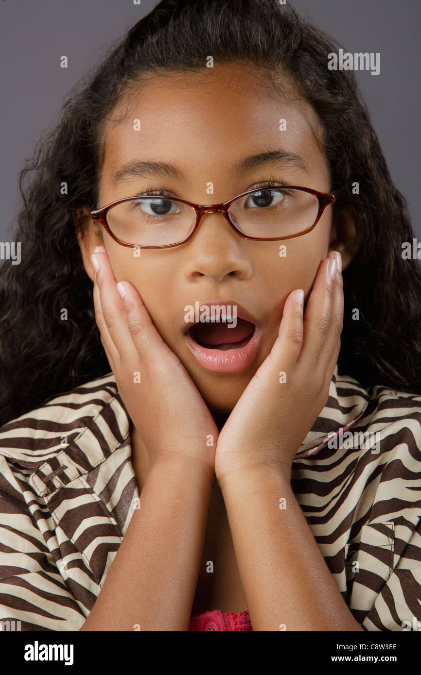 Portrait of surprised girl, studio shot Stock Photo - Alamy