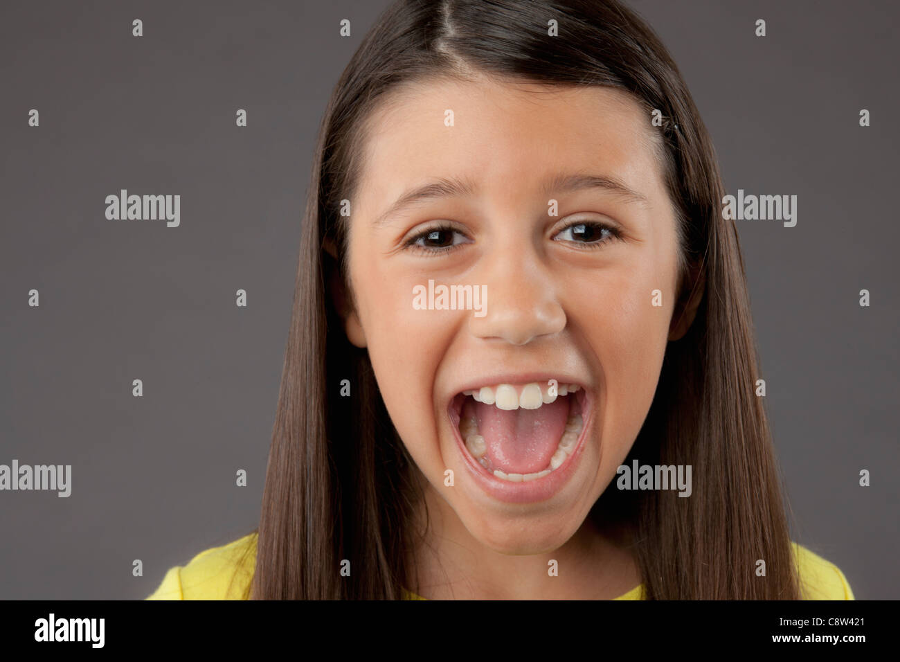 Portrait of screaming girl, studio shot Stock Photo - Alamy