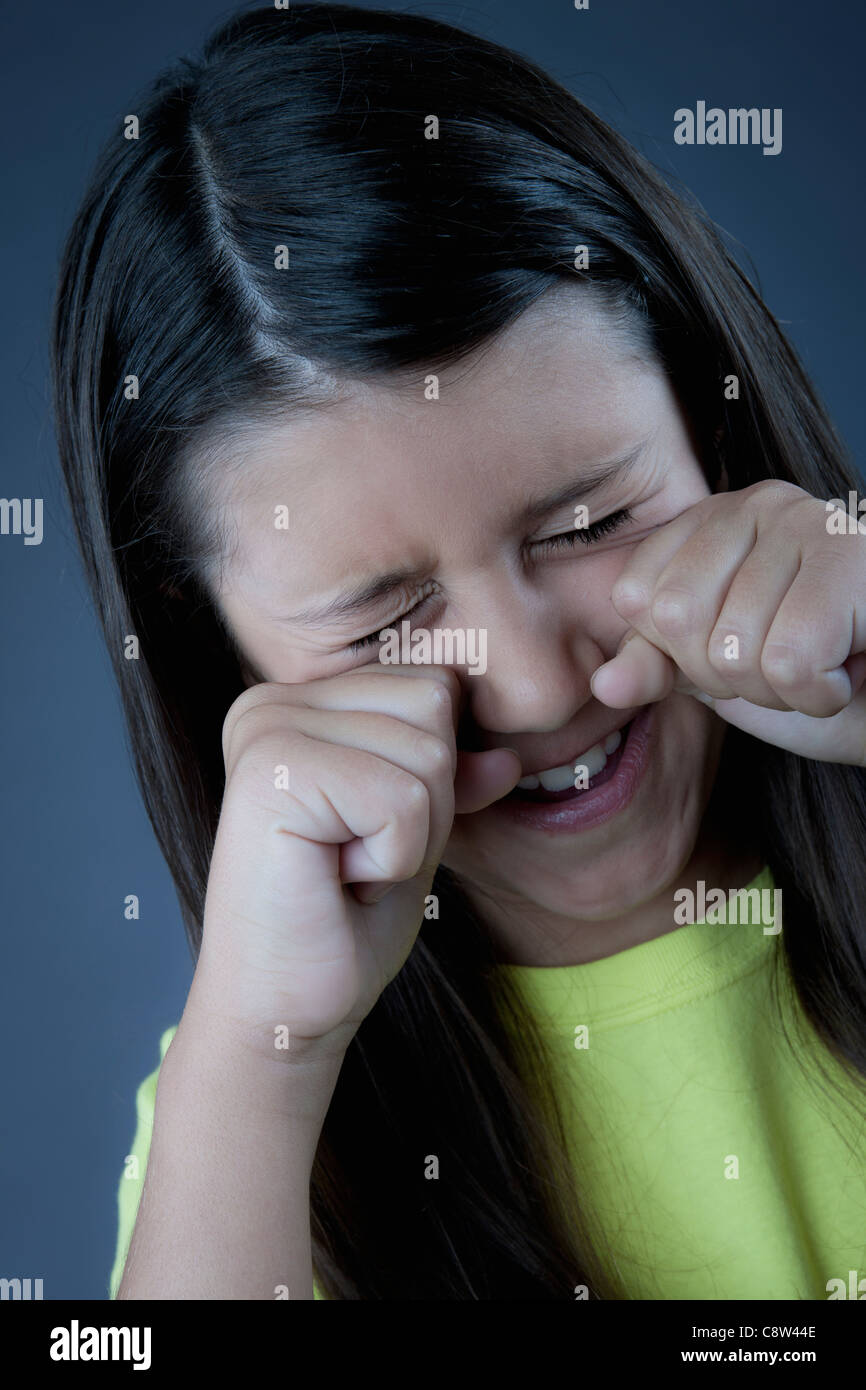 Studio portrait of girl crying Stock Photo - Alamy