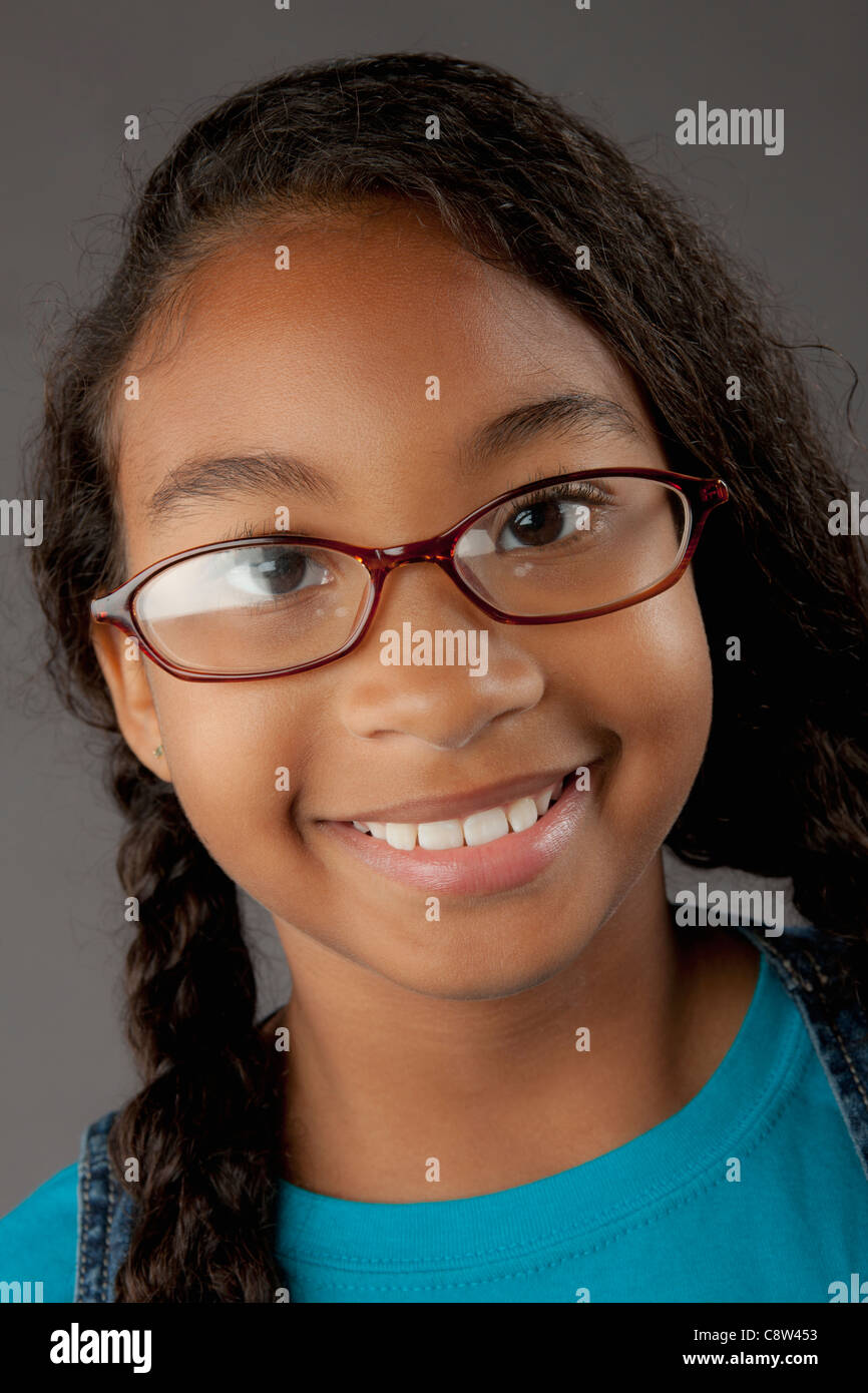 Studio portrait of girl wearing eyeglasses Stock Photo - Alamy