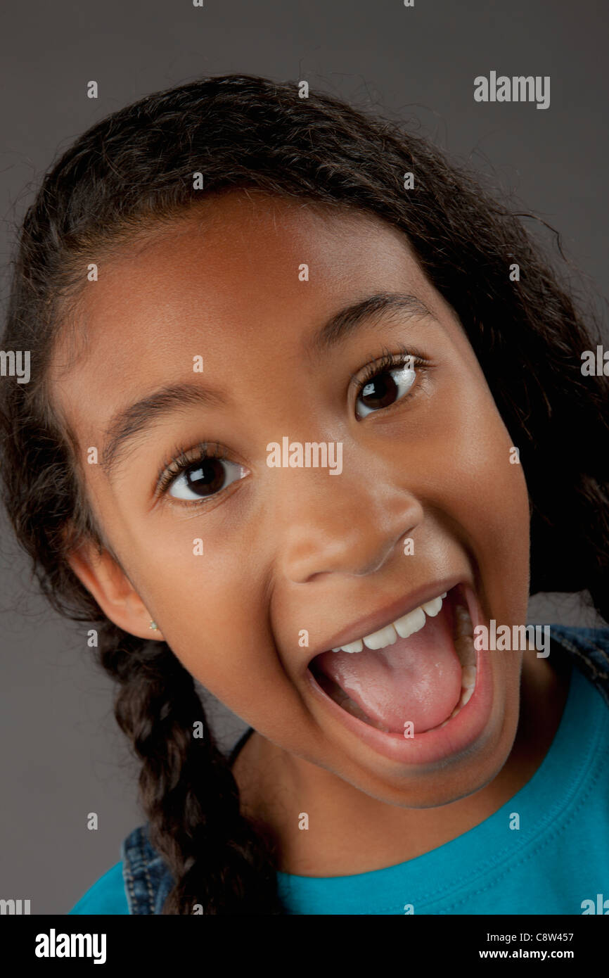 Studio portrait of girl shouting Stock Photo - Alamy