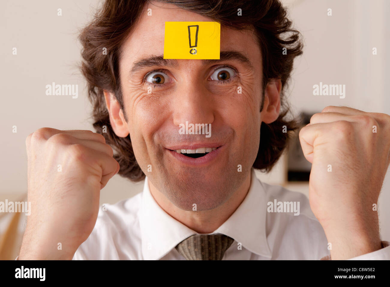 Studio portrait of businessman with adhesive note on forehead Stock ...
