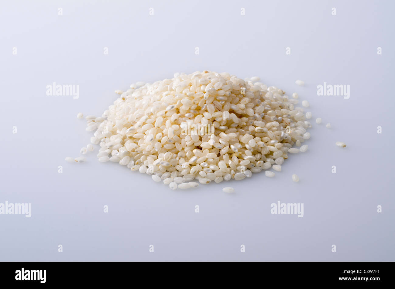 Pile of milk rice, uncooked Stock Photo - Alamy