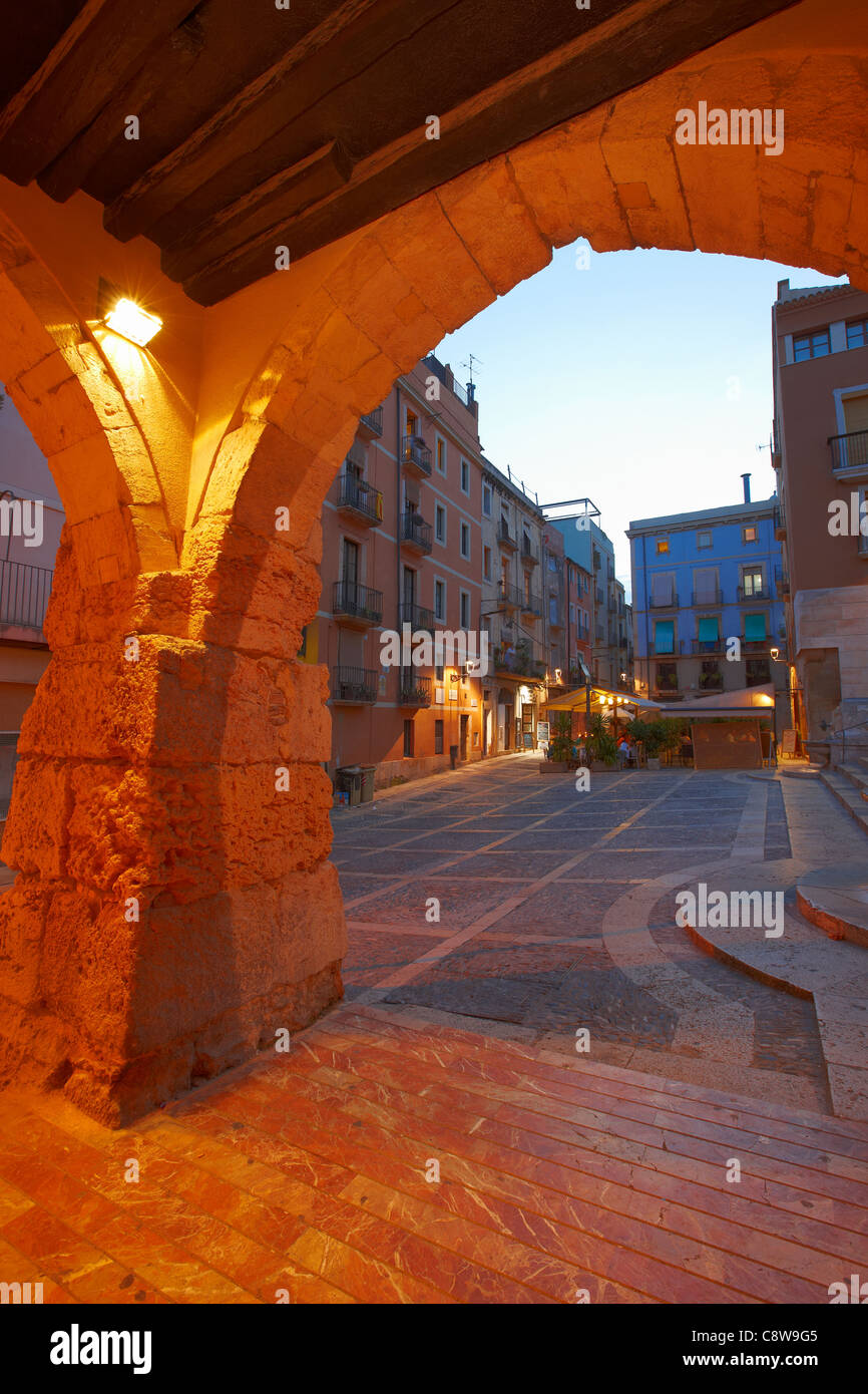 View of the Santiago Rossinyol Plaza through a 14th century arch on ...