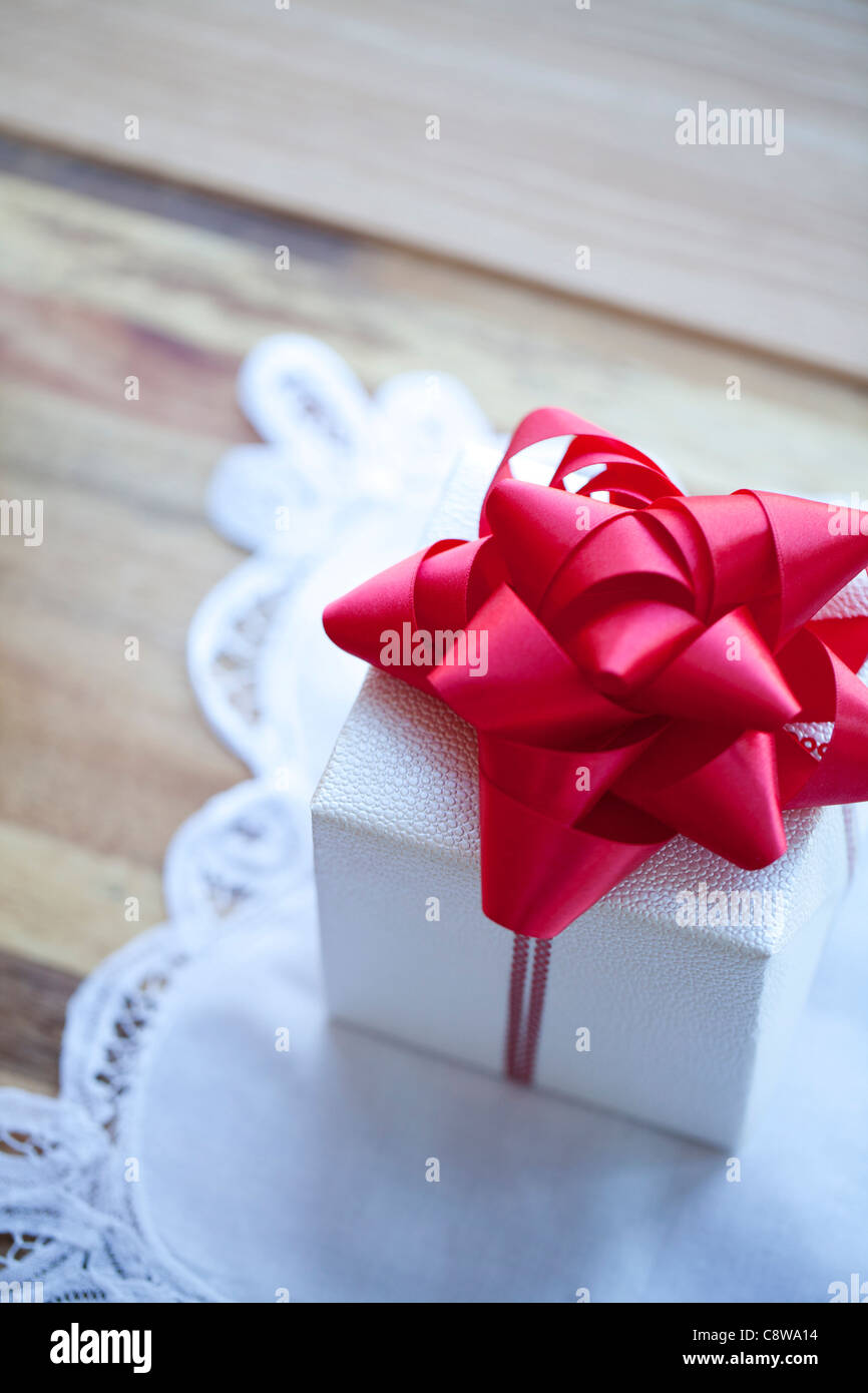 Gift wrapped by red ribbon hi-res stock photography and images - Alamy